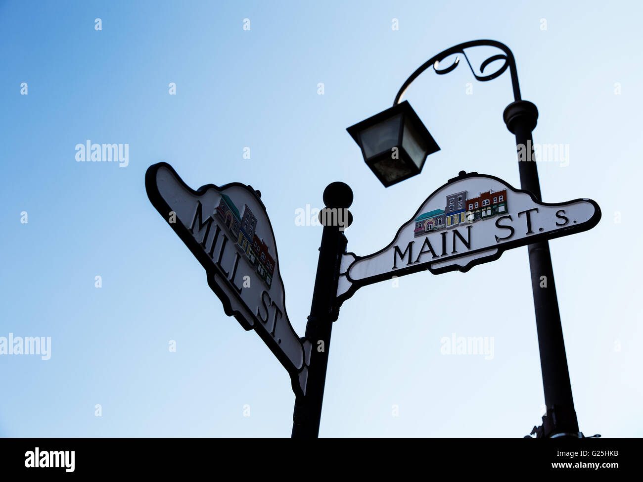 Signs on street lamp pole hi-res stock photography and images - Alamy