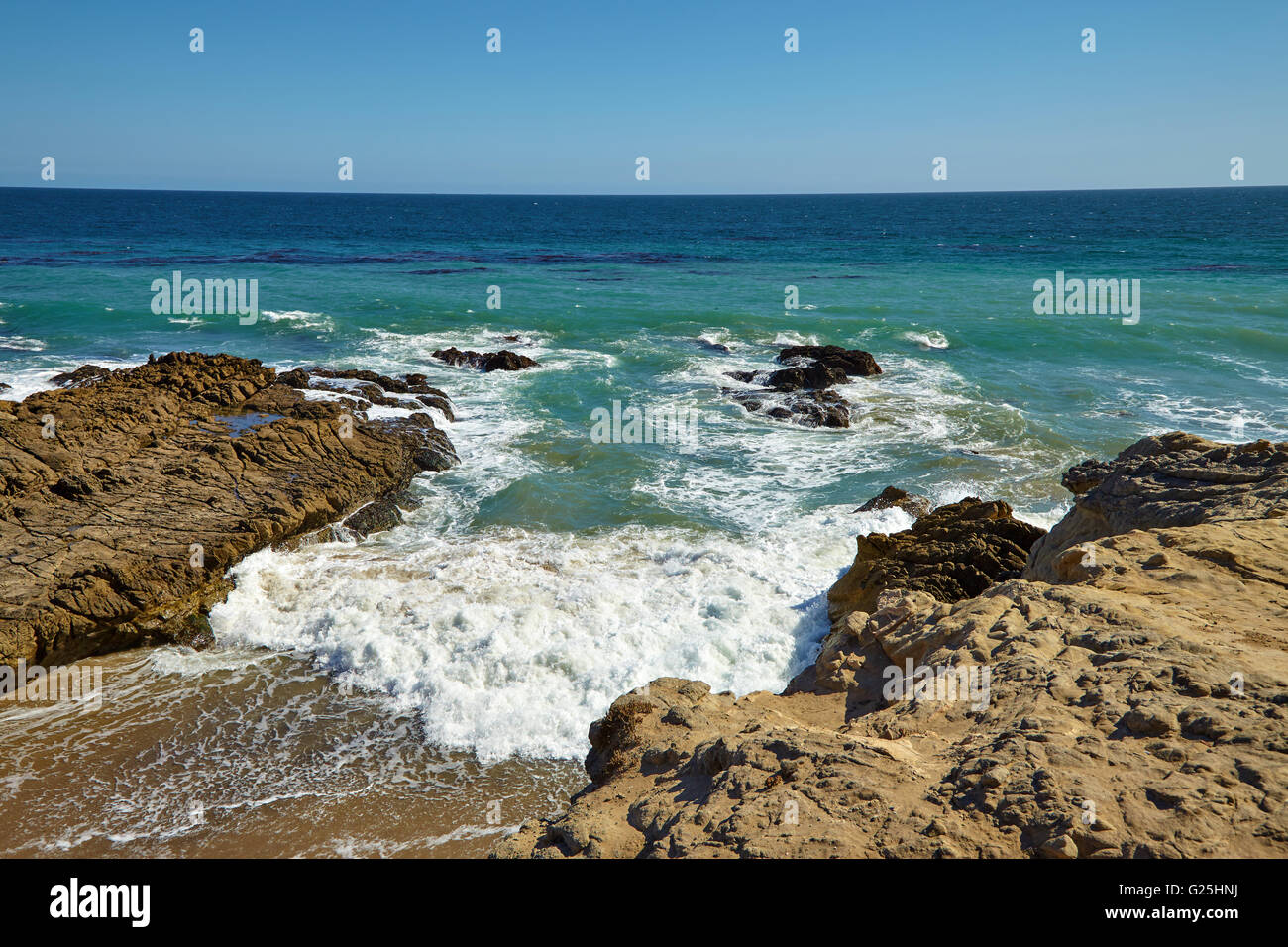 Waves beating against coastal rocks on the cliffs Stock Photo - Alamy