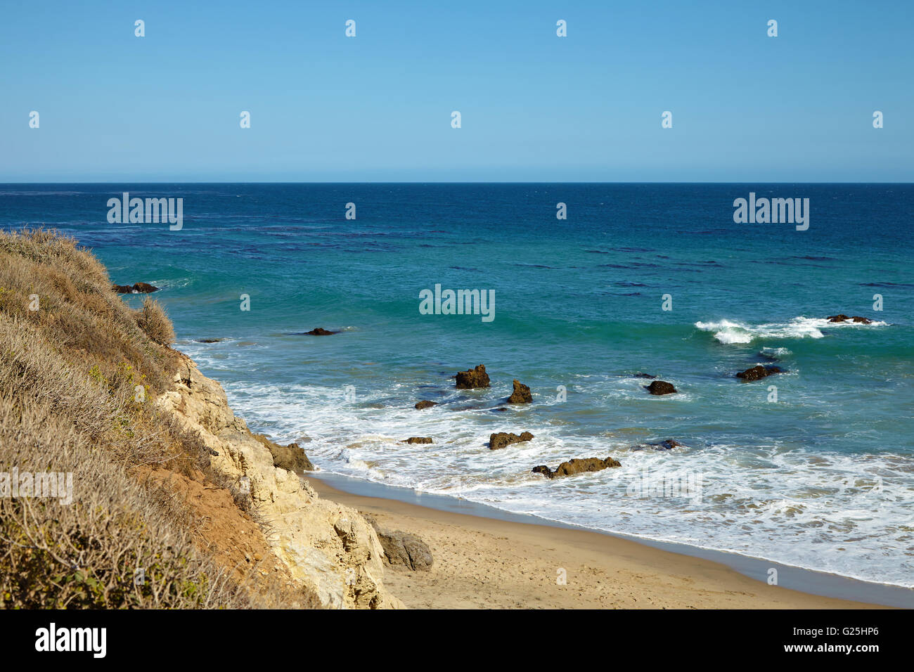Waves beating against coastal rocks on the cliffs Stock Photo - Alamy