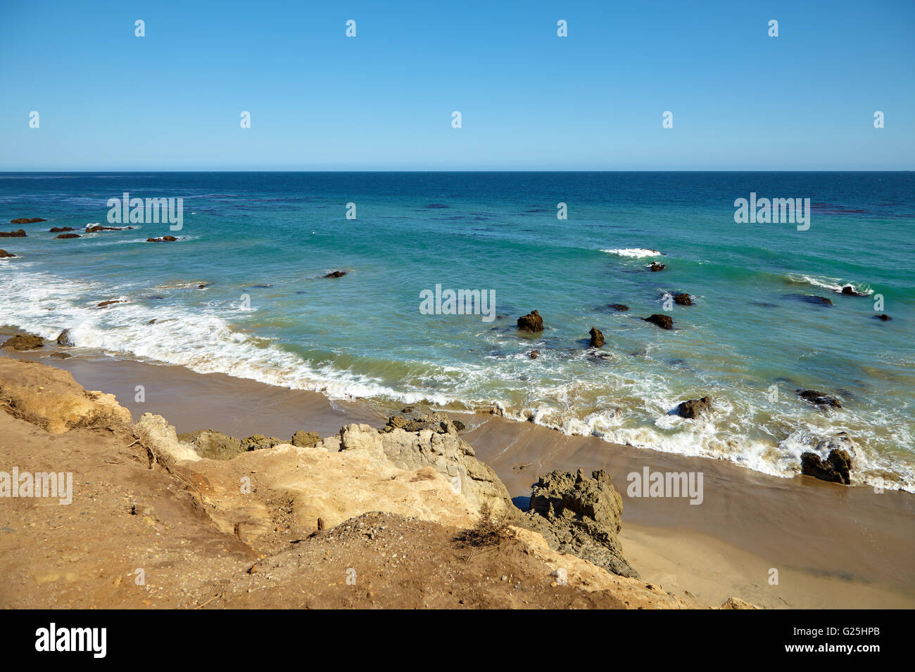 Waves beating against coastal rocks on the cliffs Stock Photo - Alamy