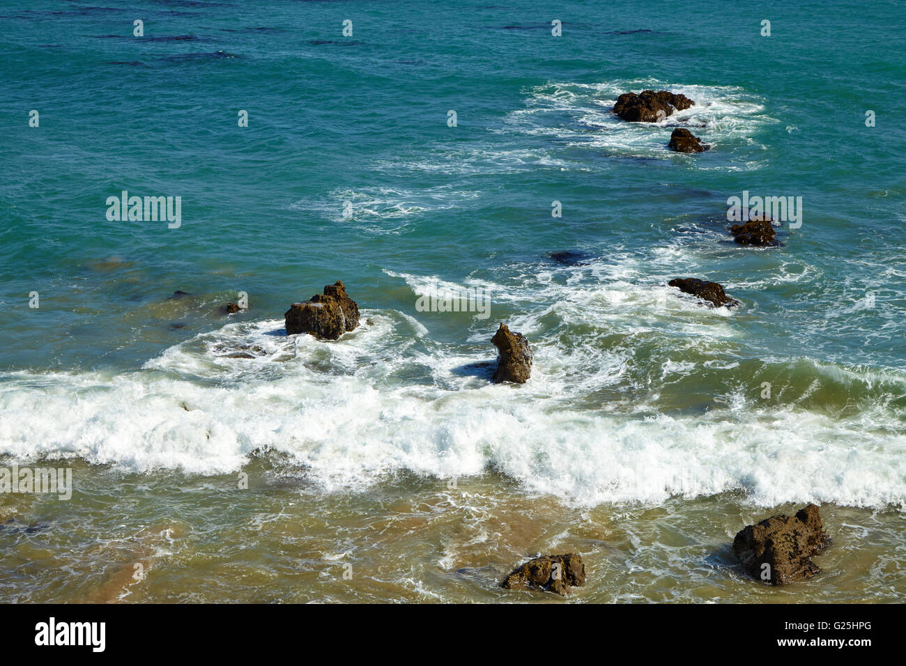 Waves beating against coastal rocks on the cliffs Stock Photo - Alamy