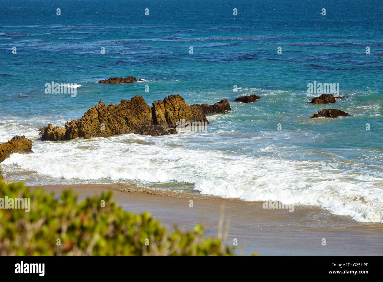 Waves beating against coastal rocks on the cliffs Stock Photo - Alamy