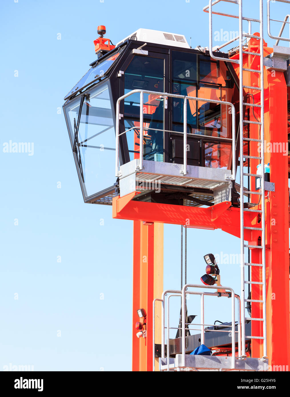 Cockpit of modern crane, industry detail. Blue sky background Stock ...