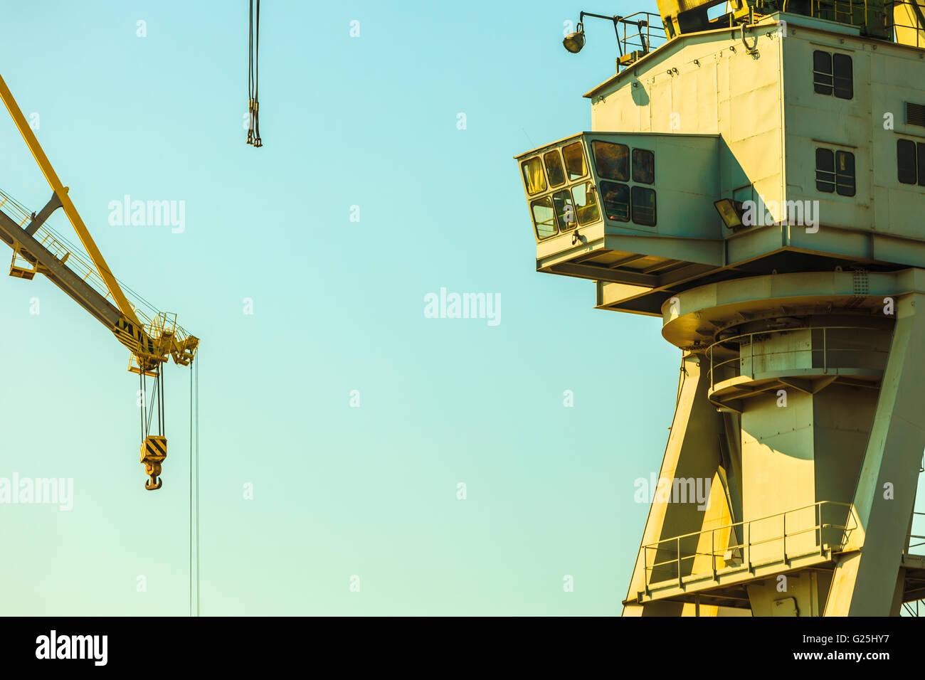 Cockpit of port crane, industry detail. Blue sky background Stock Photo ...