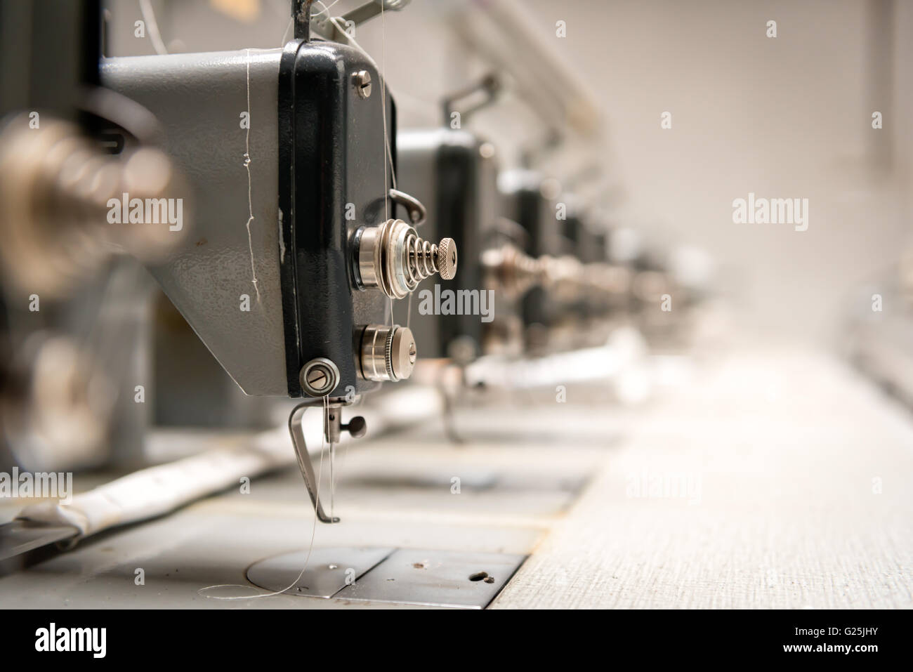 Abandoned textile factory - sewing machines Stock Photo - Alamy