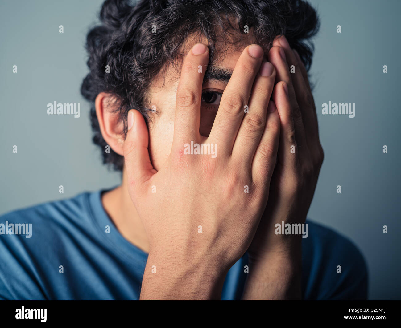 Man scared hands face hi-res stock photography and images - Alamy