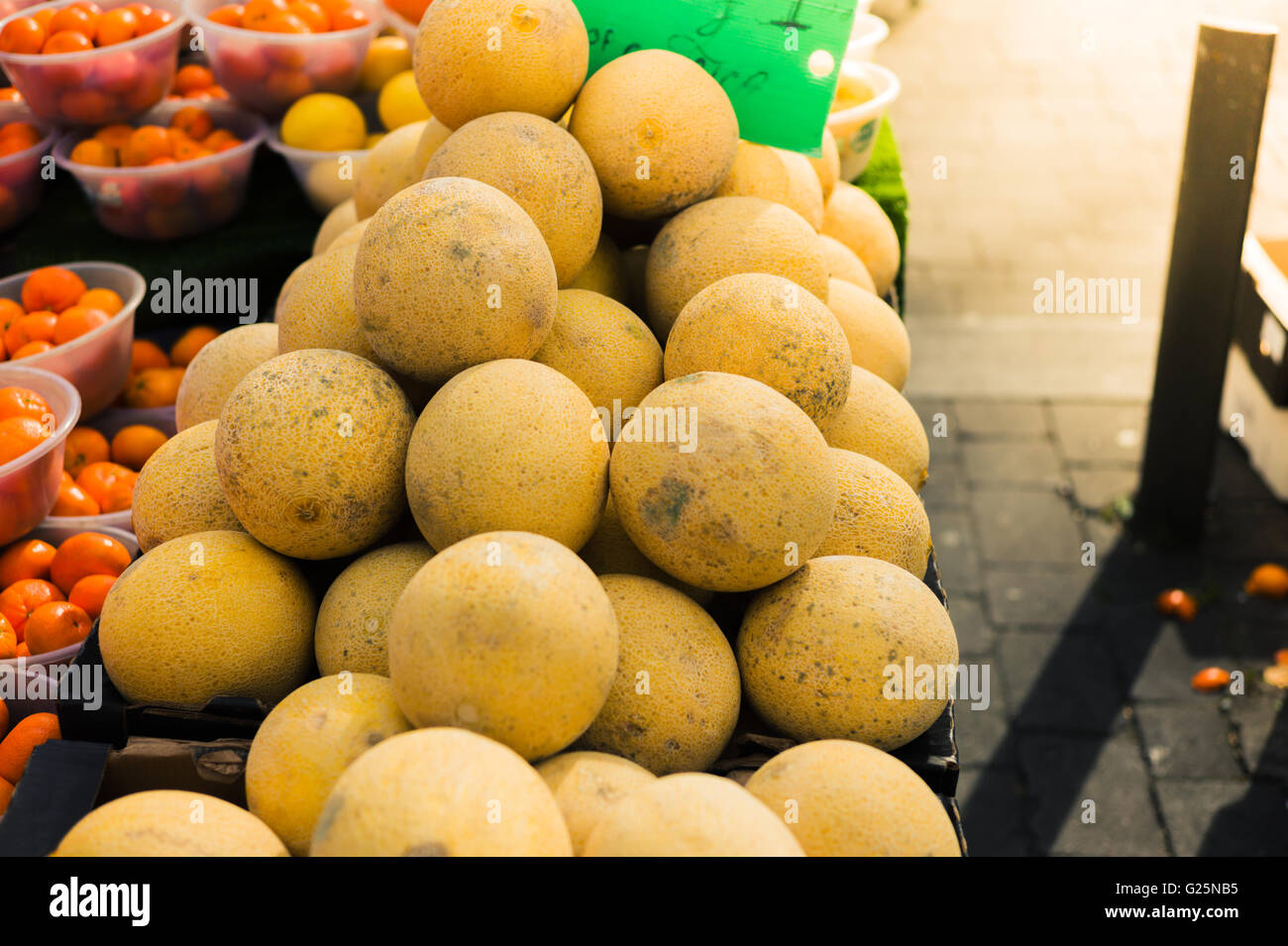 A bunch of melons at a street market Stock Photo - Alamy