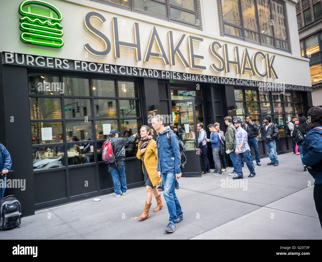 Crowds of drooling burger lovers line up to enter the new Shake Shack ...