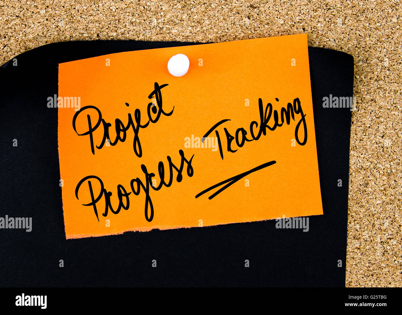 Project Progress Tracking written on orange paper note pinned on cork ...