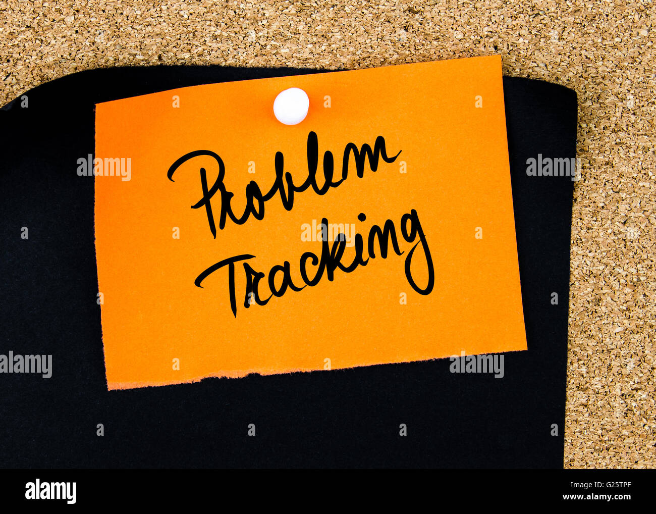 Problem Tracking written on orange paper note pinned on cork board with ...