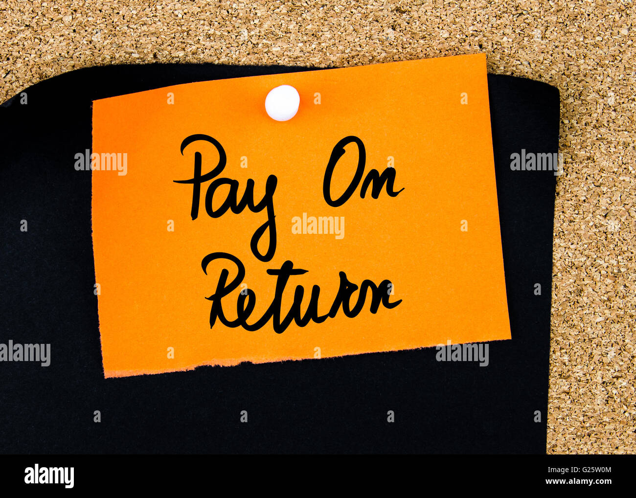 Pay On Return written on orange paper note pinned on cork board with ...