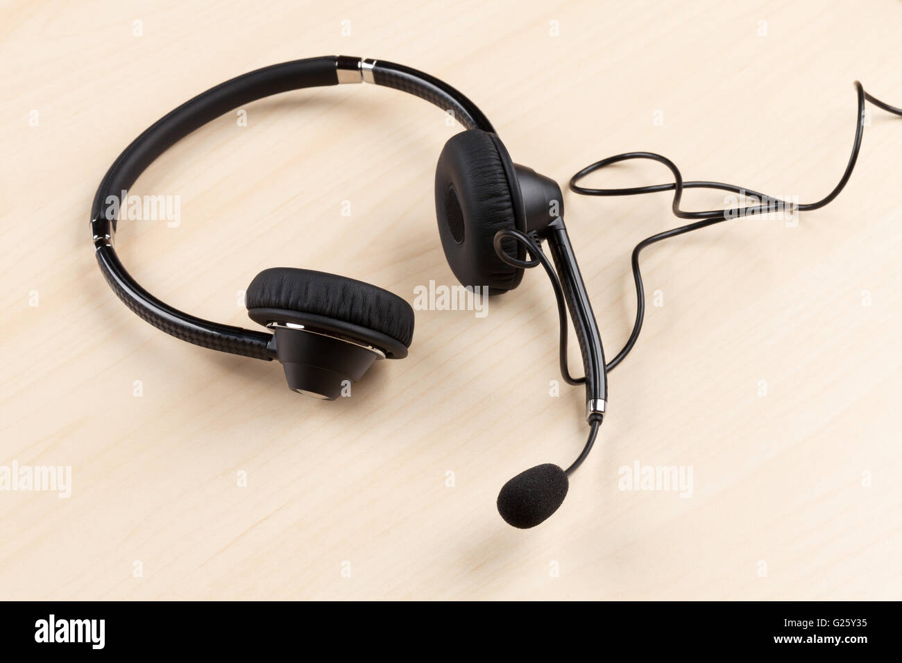 Office desk with headset. Call center support table Stock Photo - Alamy
