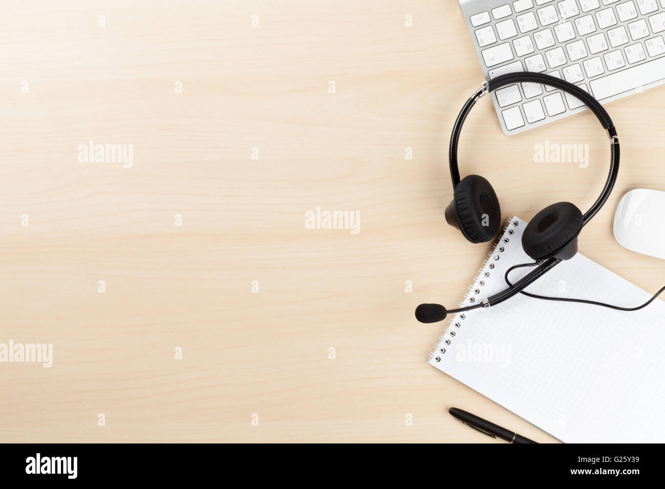 Office desk with headset and pc. Call center support table. Top veiw ...