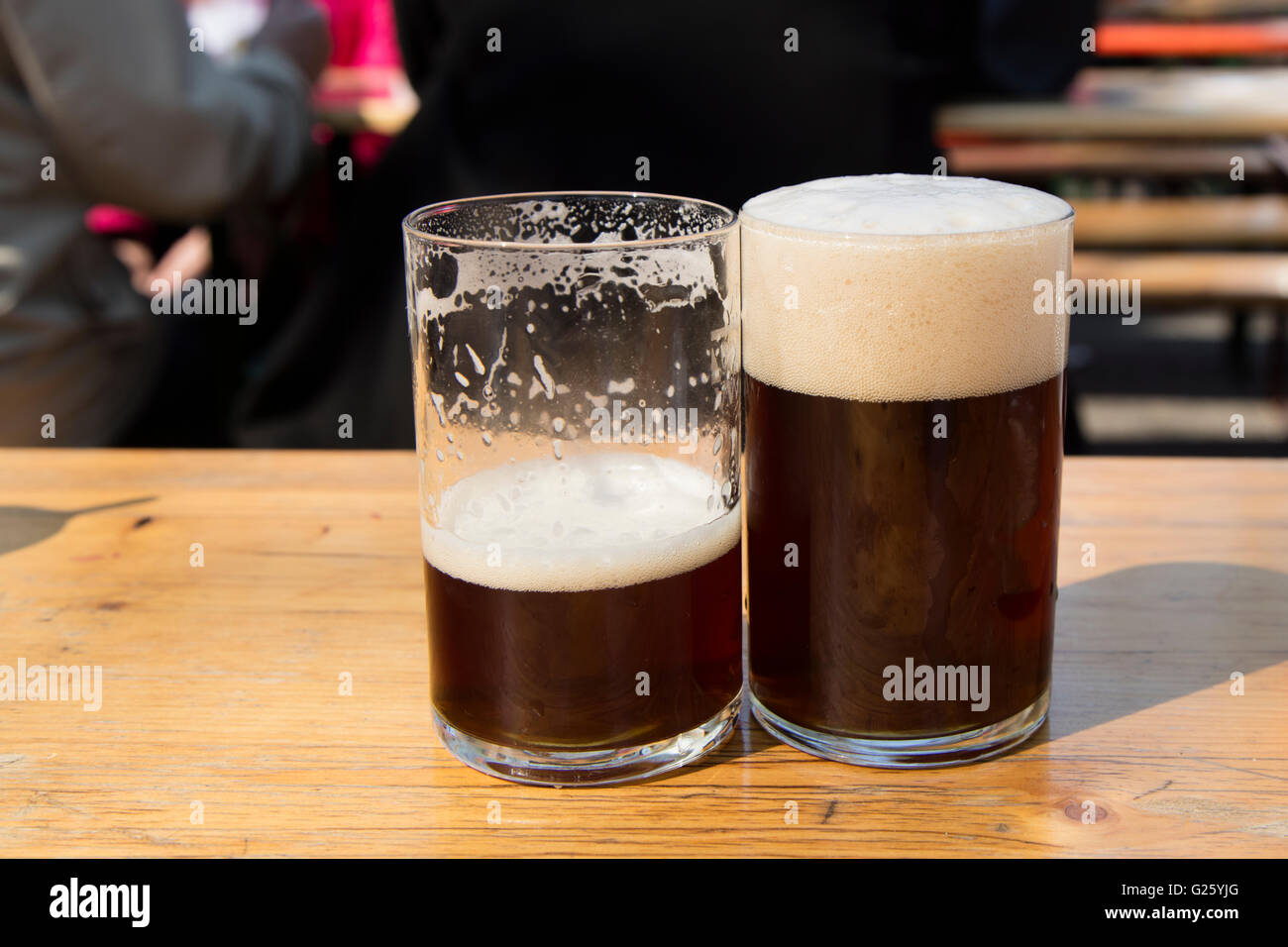 Detail of glasses of german alt beer, typical from dusseldorf, one full ...
