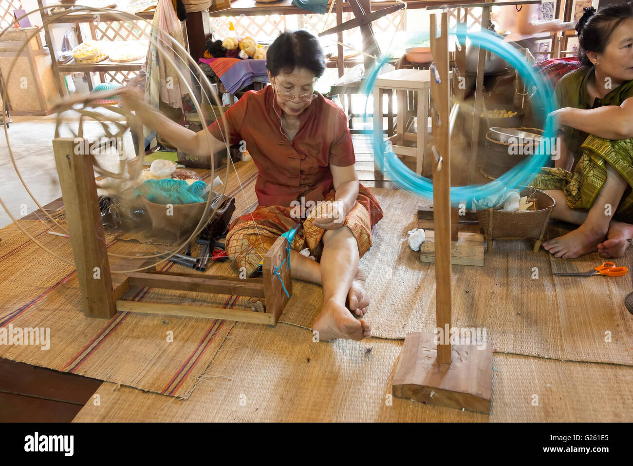 Thai woman working with Old Silk weaving Handicraft machine Tai Dam ...