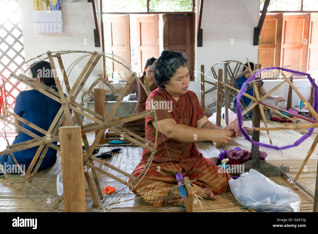 Thai women working with Old Silk weaving Handicraft machine Tai Dam ...