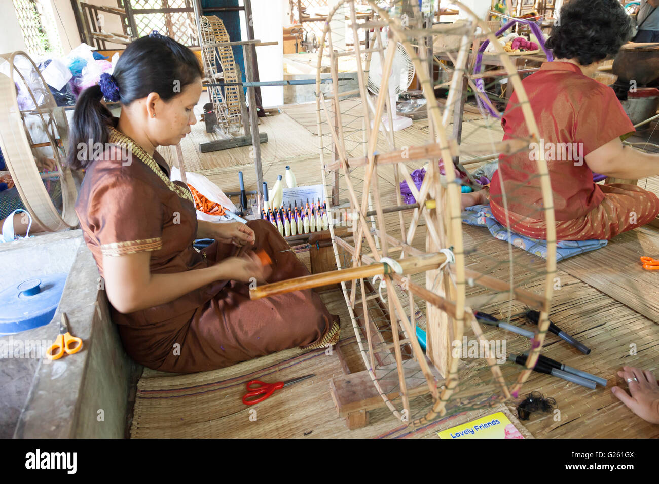 Thai woman working with Old Silk weaving Handicraft machine Tai Dam ...