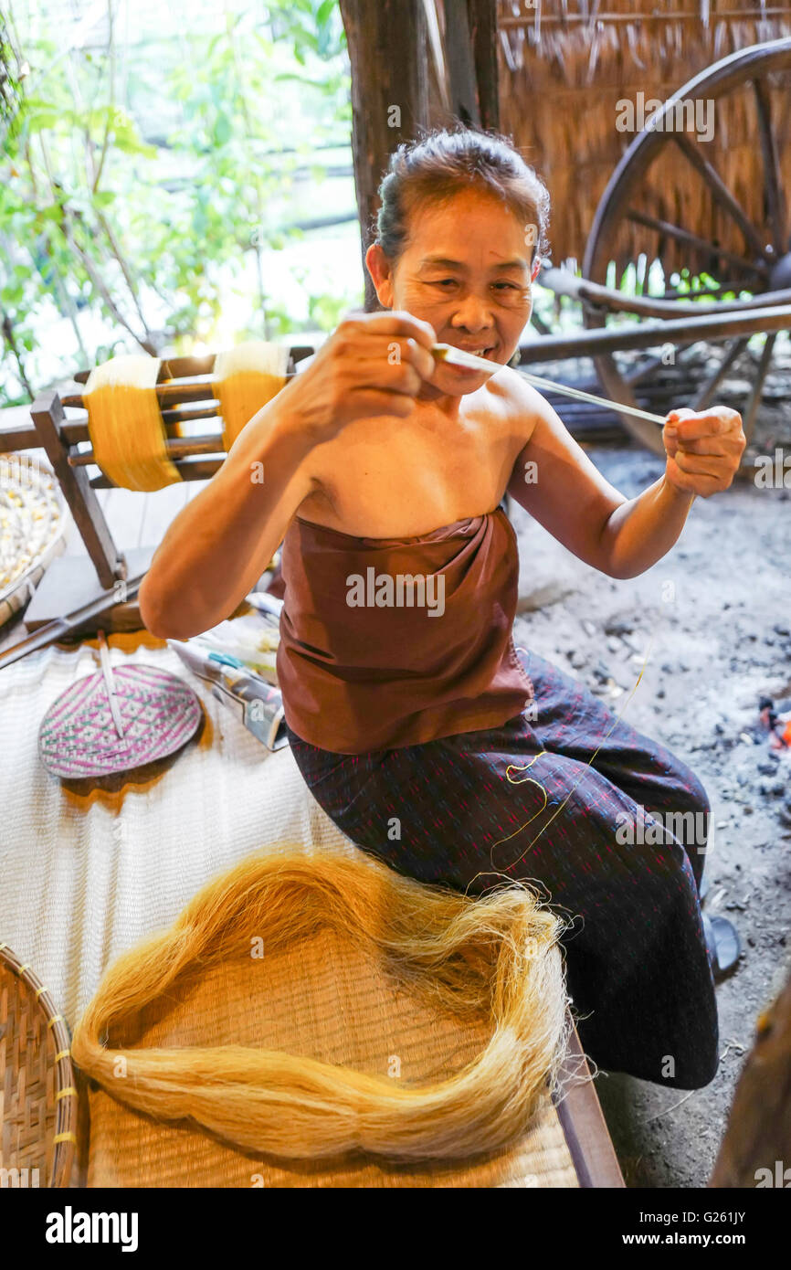 Thai woman working with Old Silk weaving Handicraft machine Tai Dam ...