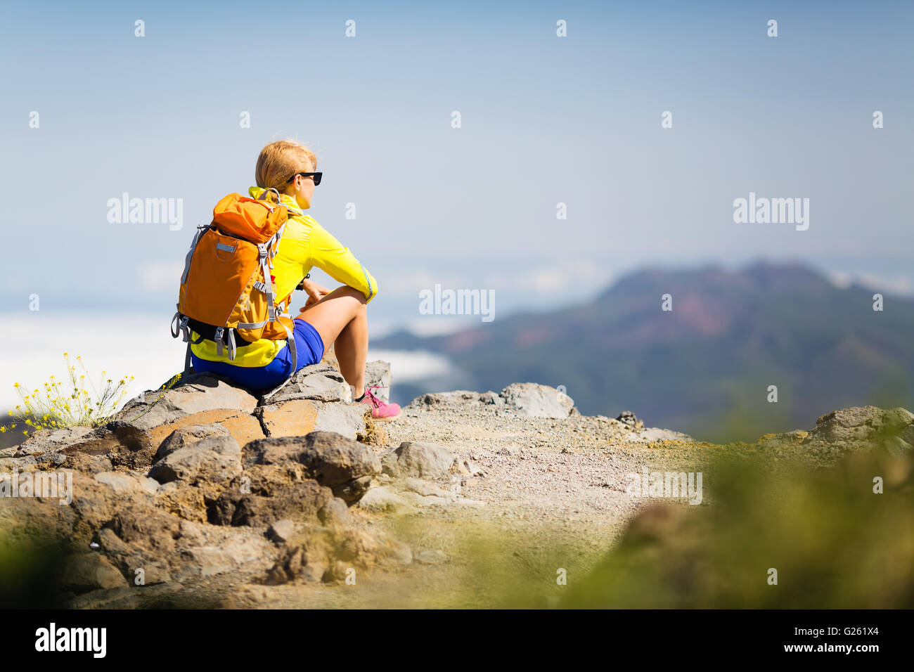 Woman successful hiking climbing in mountains, motivation and ...