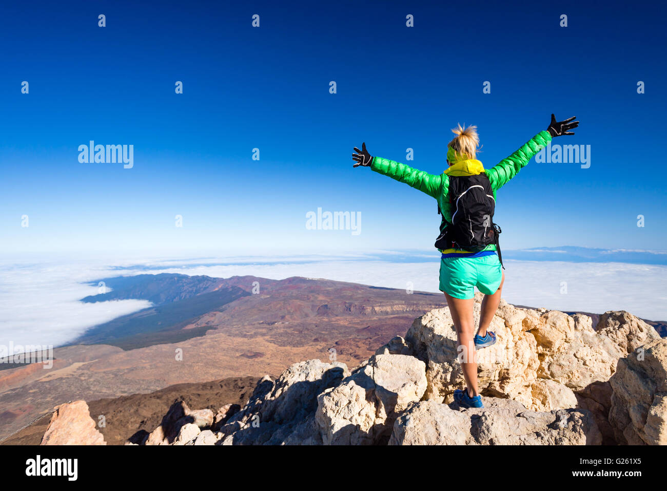 Woman successful hiking climbing in mountains, motivation and ...