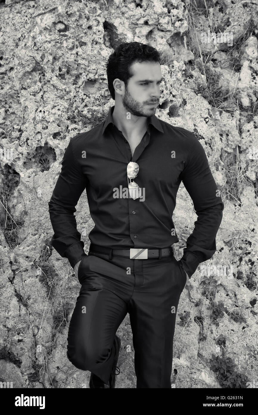 Half Body Shot of a Gorgeous Young Businessman Standing Against Boulder ...