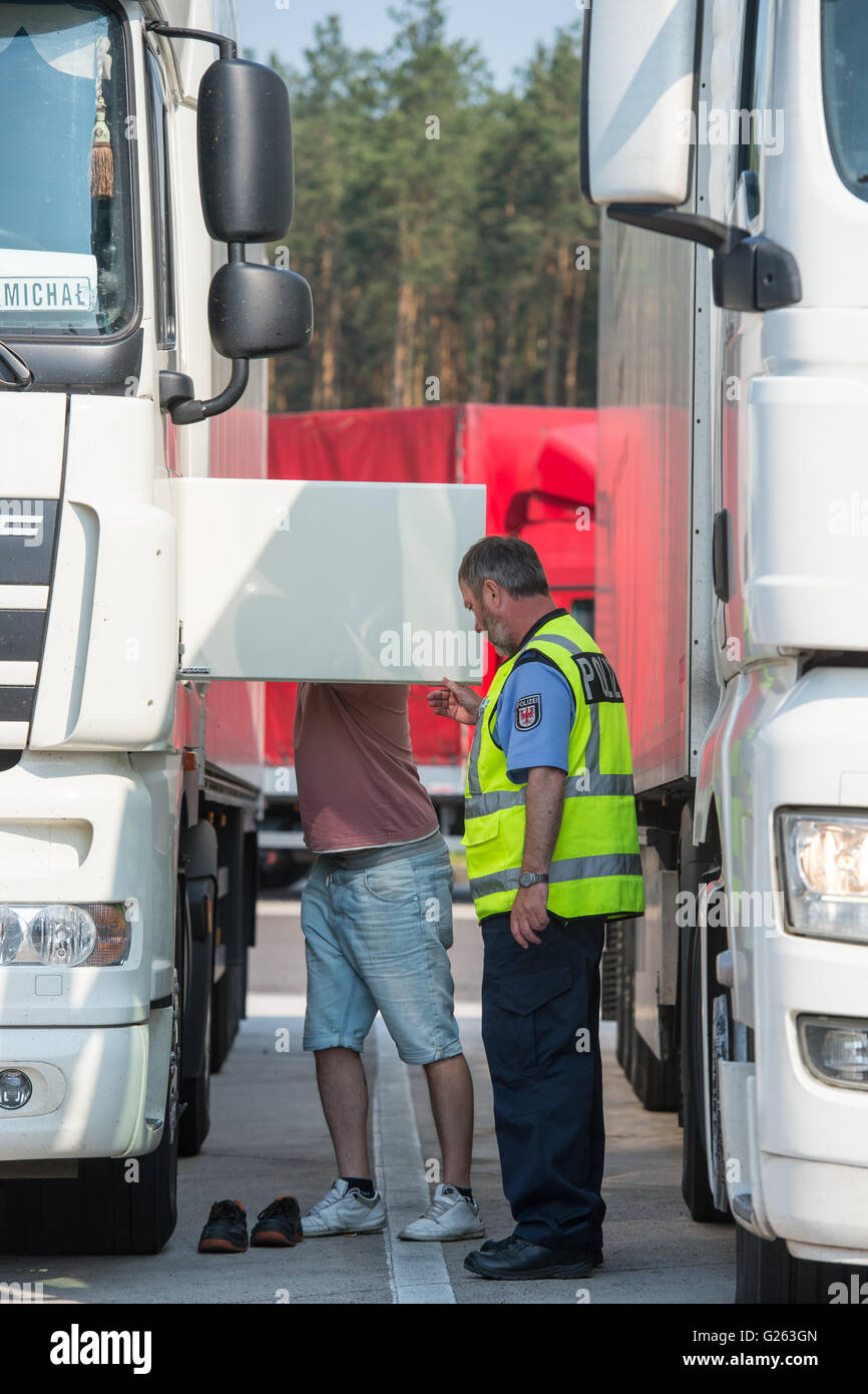 Briesen, Germany. 24th May, 2016. A member of the German police ...