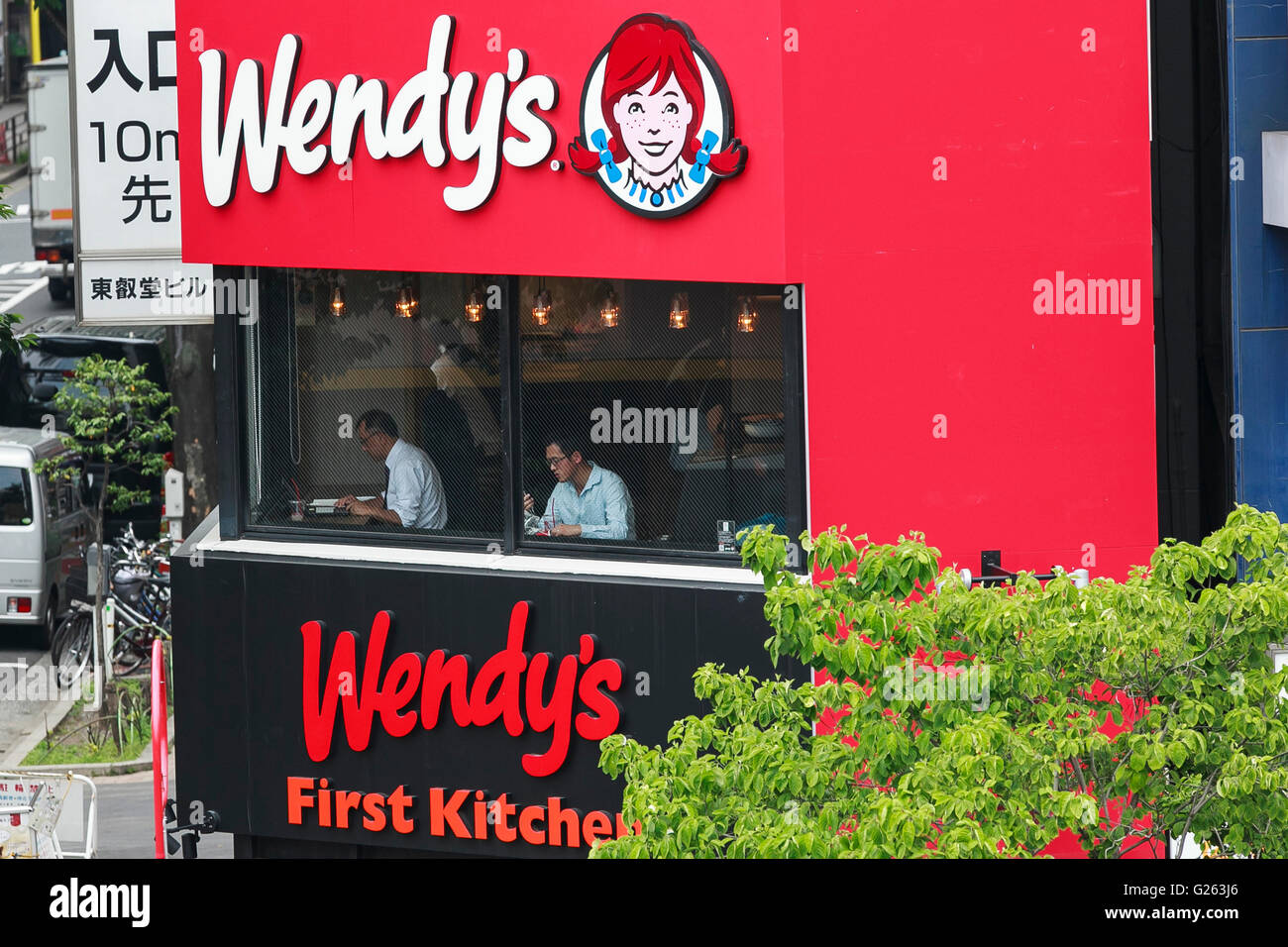 Customers eat at a combined Wendy's and First-Kitchen joint fast food ...