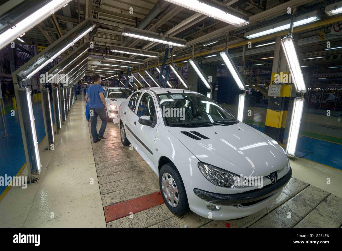 Tehran, Iran. 14th May, 2016. Cars move through the final paint ...