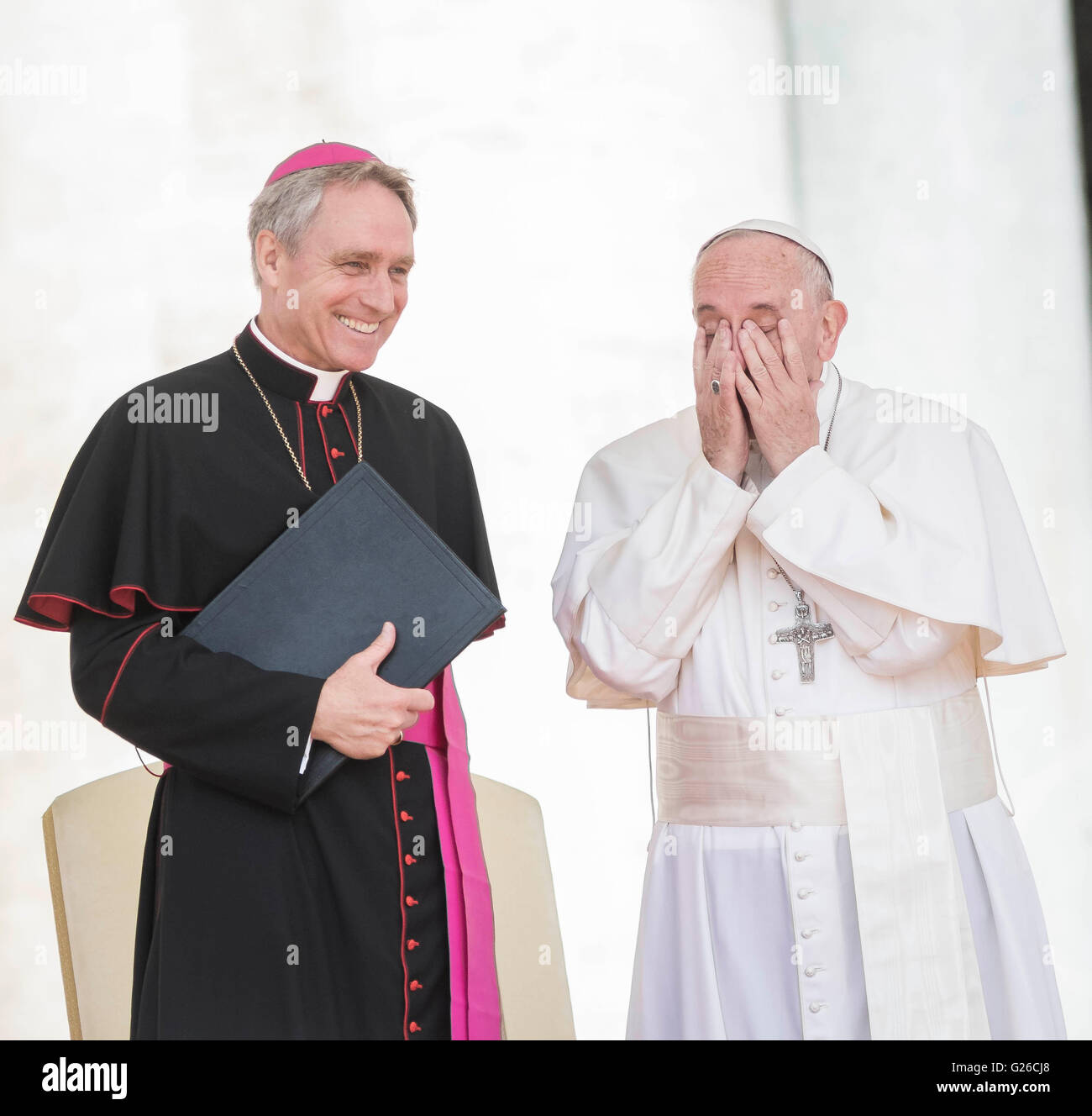 Vatican City, Vatican. 25th May, 2016. Pope Francis covers his faces as ...