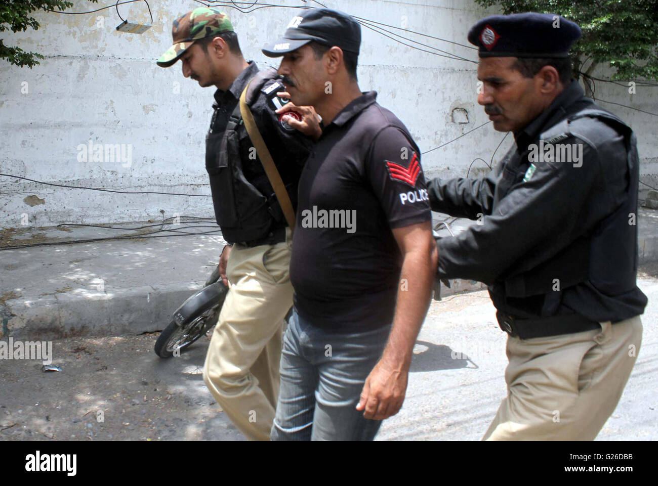 Police staffs detained a police guard wearing improper uniform, during ...