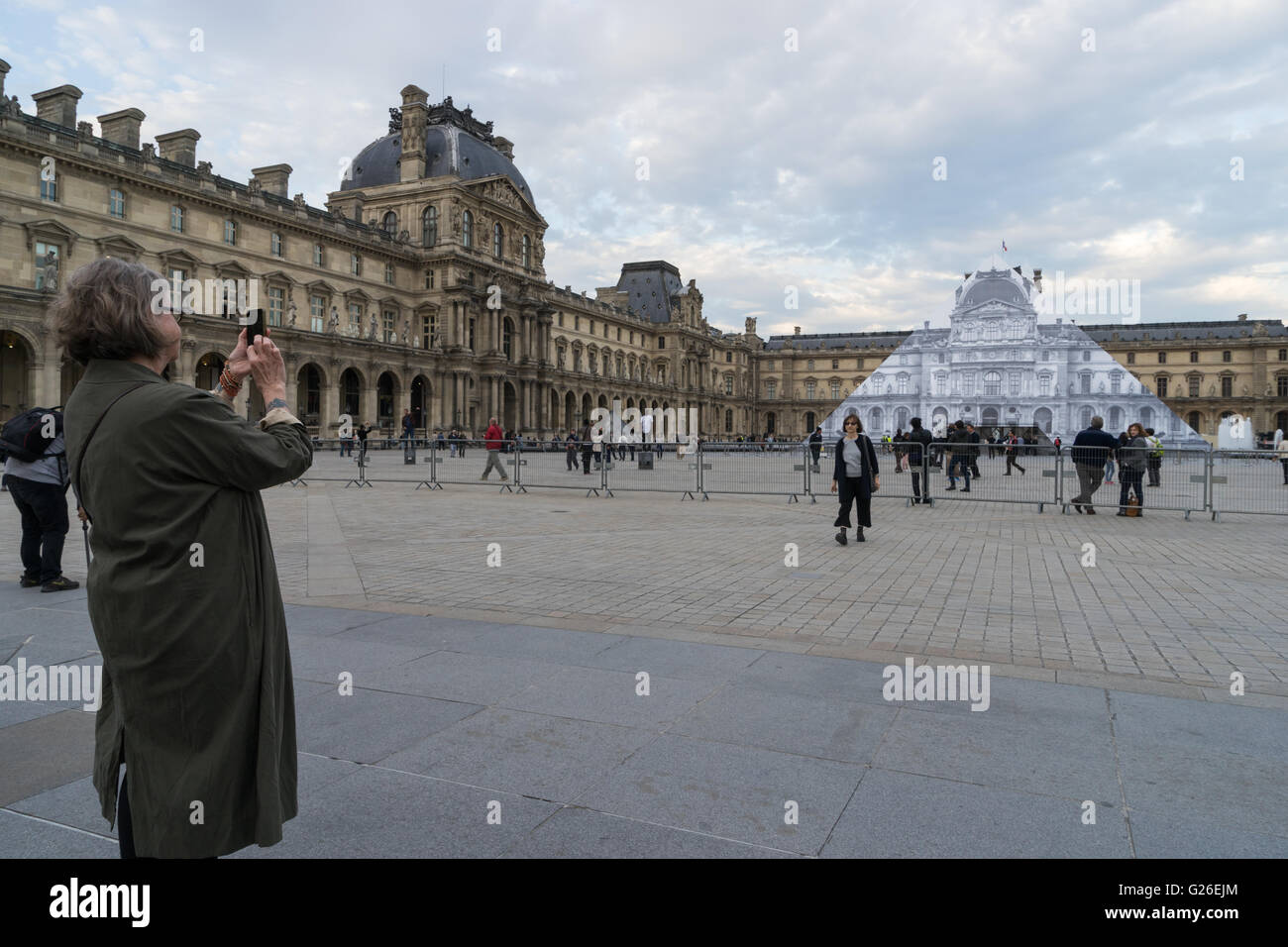 Louvre museum pyramid covered with thousands of paper sheets to make it ...