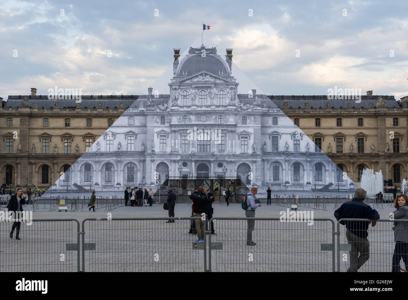 Louvre museum pyramid covered with thousands of paper sheets to make it ...