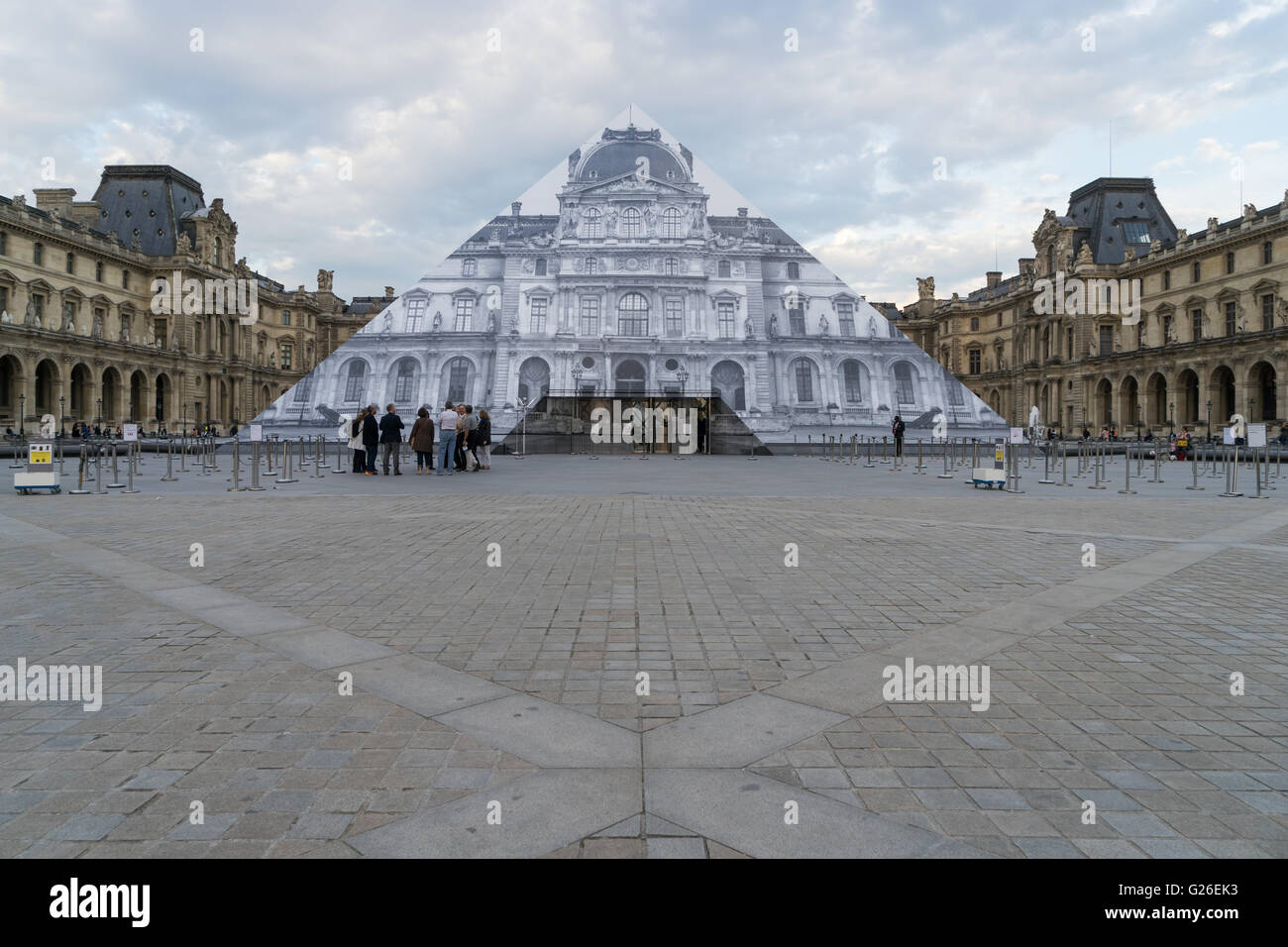 Louvre museum pyramid covered with thousands of paper sheets to make it ...
