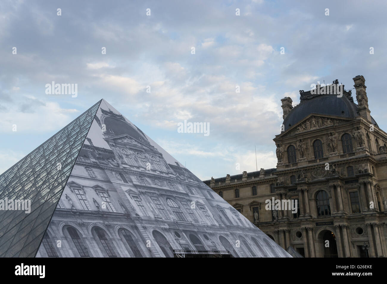 Louvre museum pyramid covered with thousands of paper sheets to make it ...