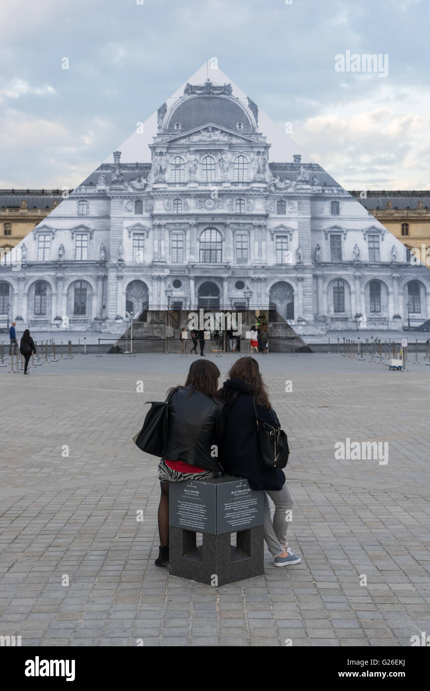 Louvre museum pyramid covered with thousands of paper sheets to make it ...