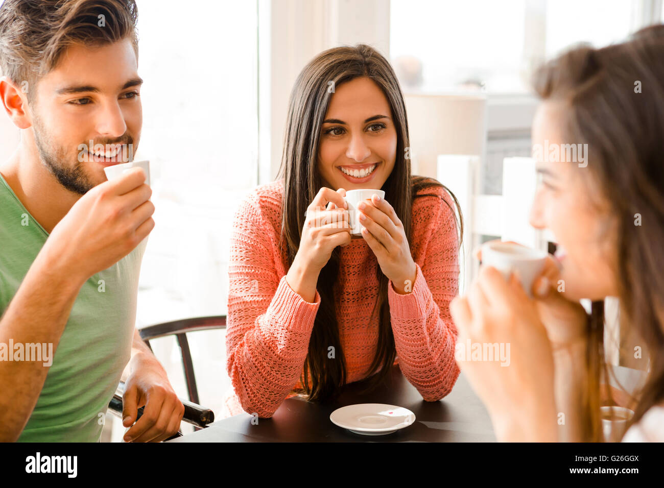Young friends having coffee break hi-res stock photography and images ...