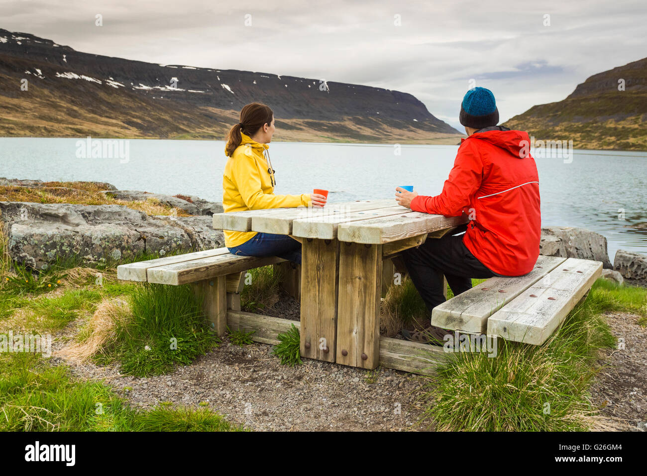 A couple drinking tea close to a beautiful lake Stock Photo - Alamy