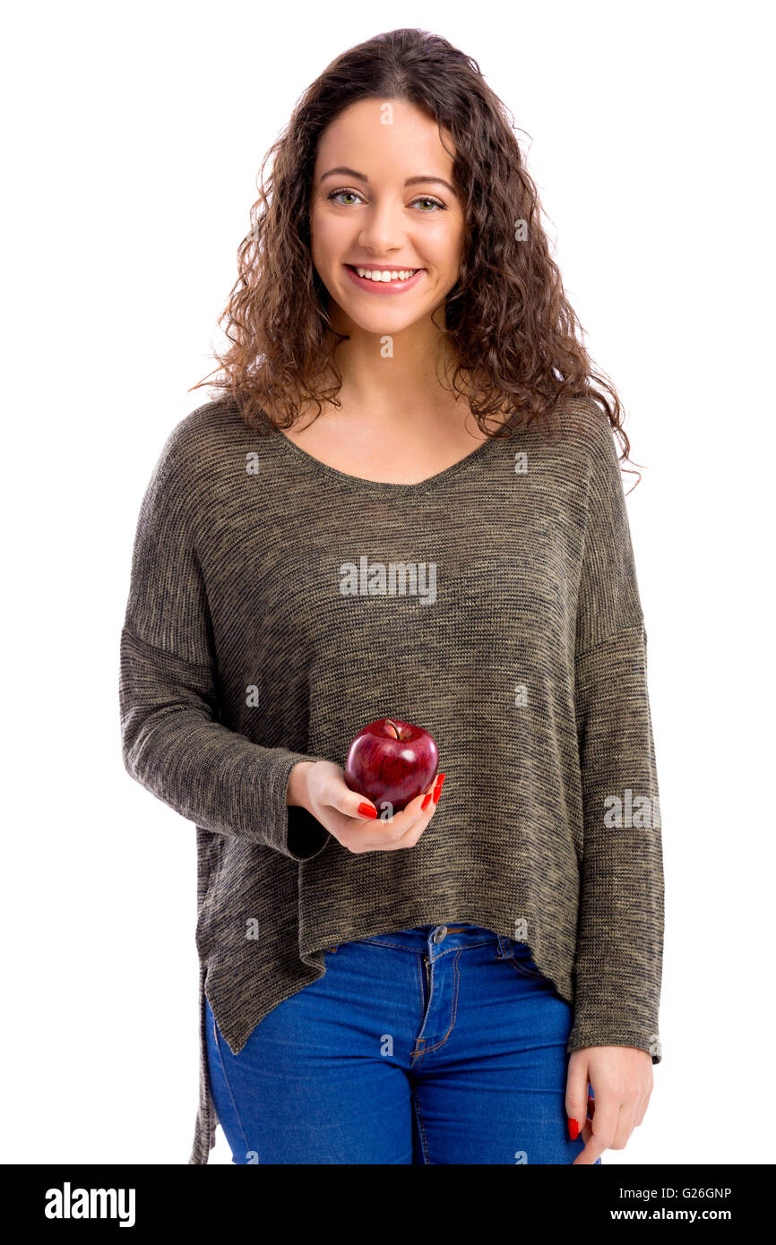 Portrait of a beautiful woman holding a fresh red apple, isolated in ...
