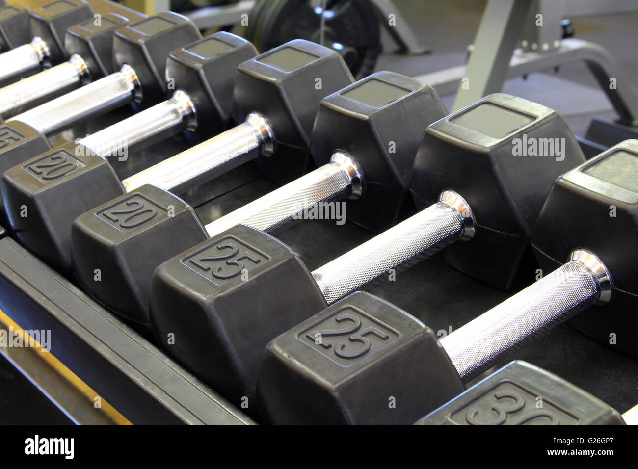 close up Gym Equipment barbells laying of a rack Stock Photo - Alamy
