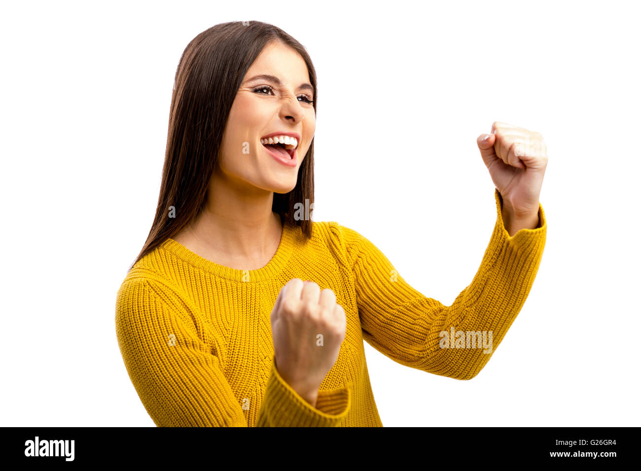 Beautiful and happy woman with arms up, isolated over white background ...