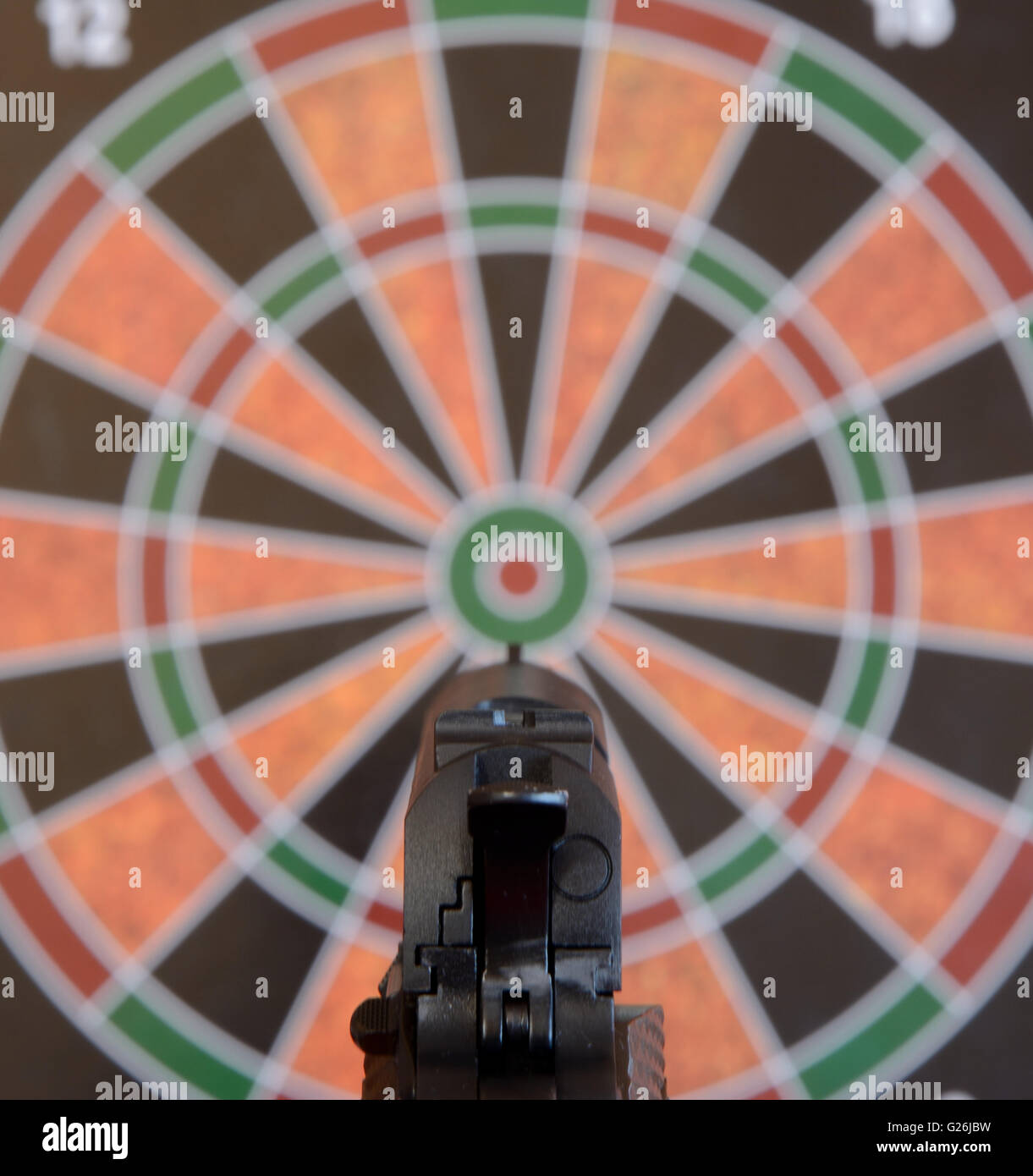 Airsoft gun aiming at target - dartboard Stock Photo - Alamy