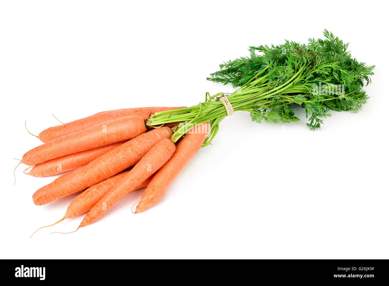 a bunch of raw carrots on a white background Stock Photo - Alamy