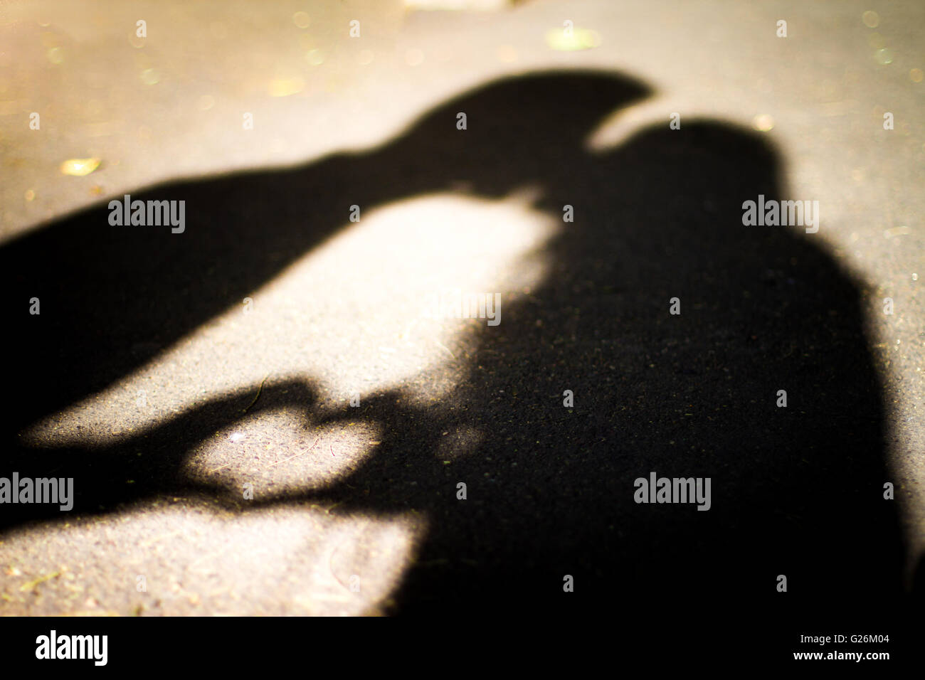 The heart of the shadows, and couple kiss Stock Photo - Alamy