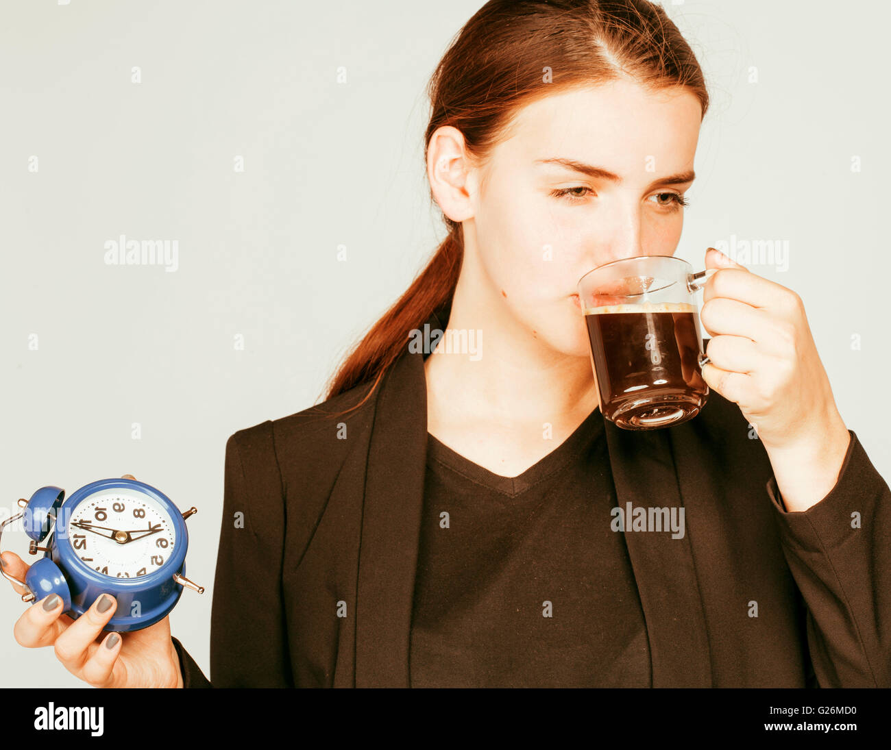 young beauty woman in business style costume waking up for work early ...