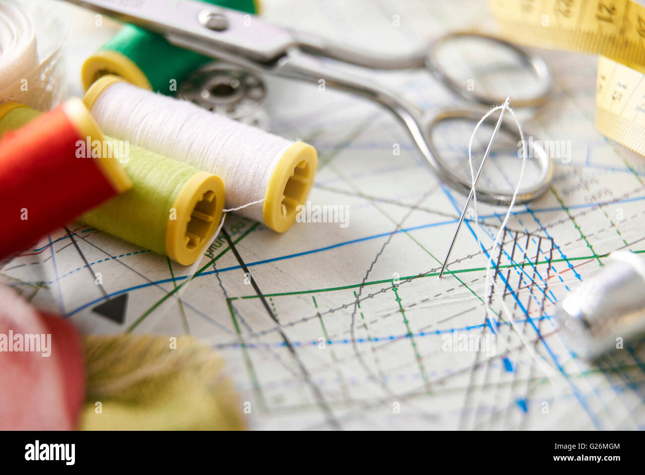 Tailoring tools on clothing pattern close up. Horizontal composition ...