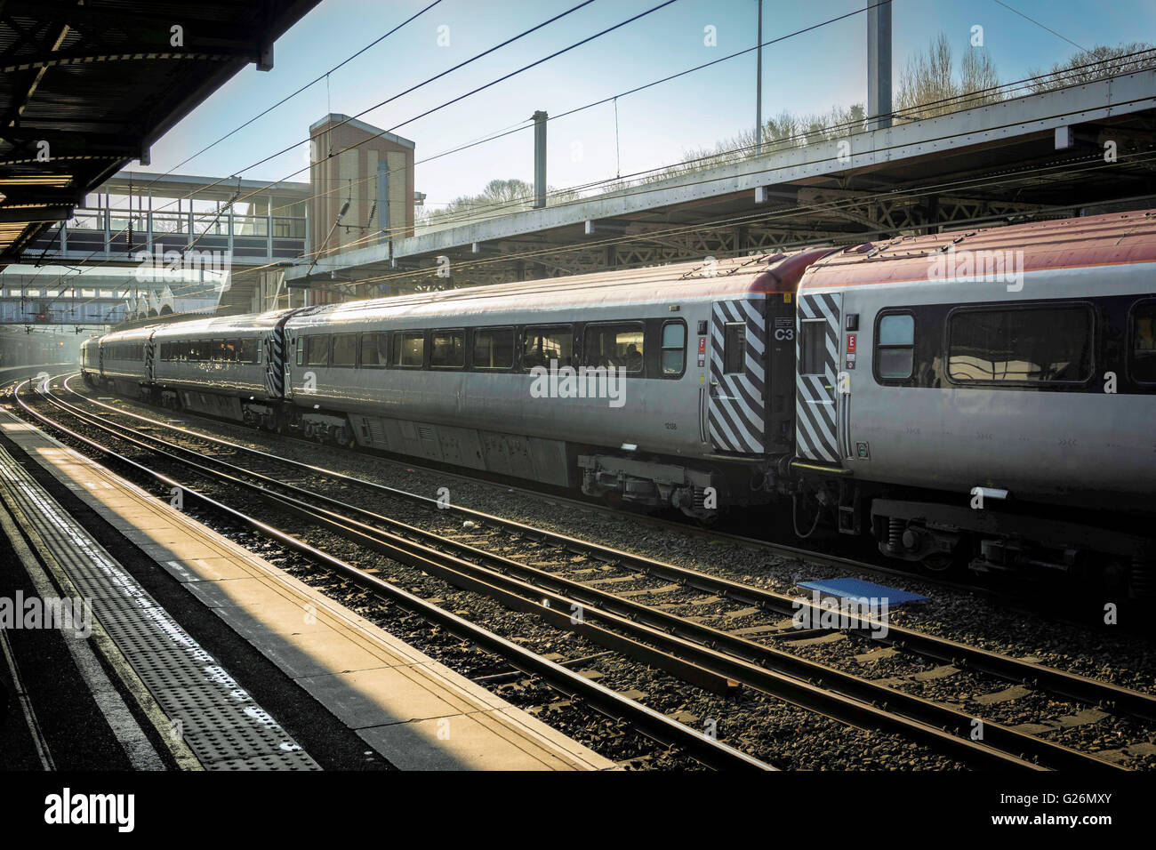 TraIn at the platform with diminishing view of tracks Stock Photo - Alamy
