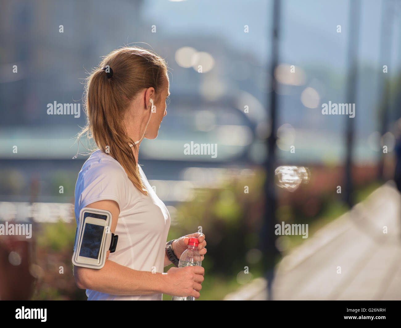 portrait of jogging woman before running on early morning with sunrise ...