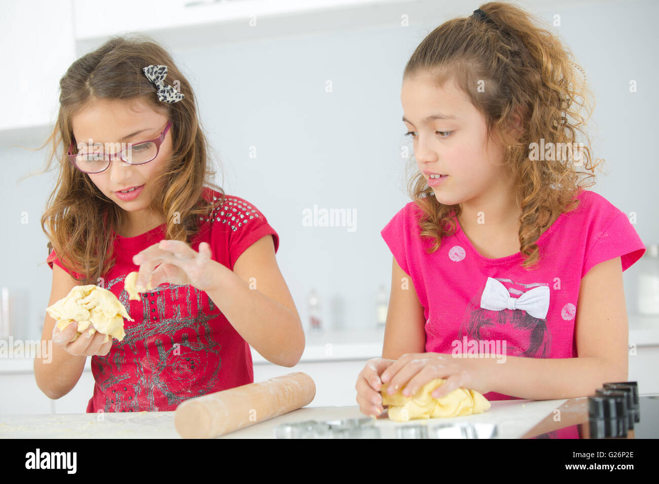 Sisters baking in the kitchen Stock Photo - Alamy