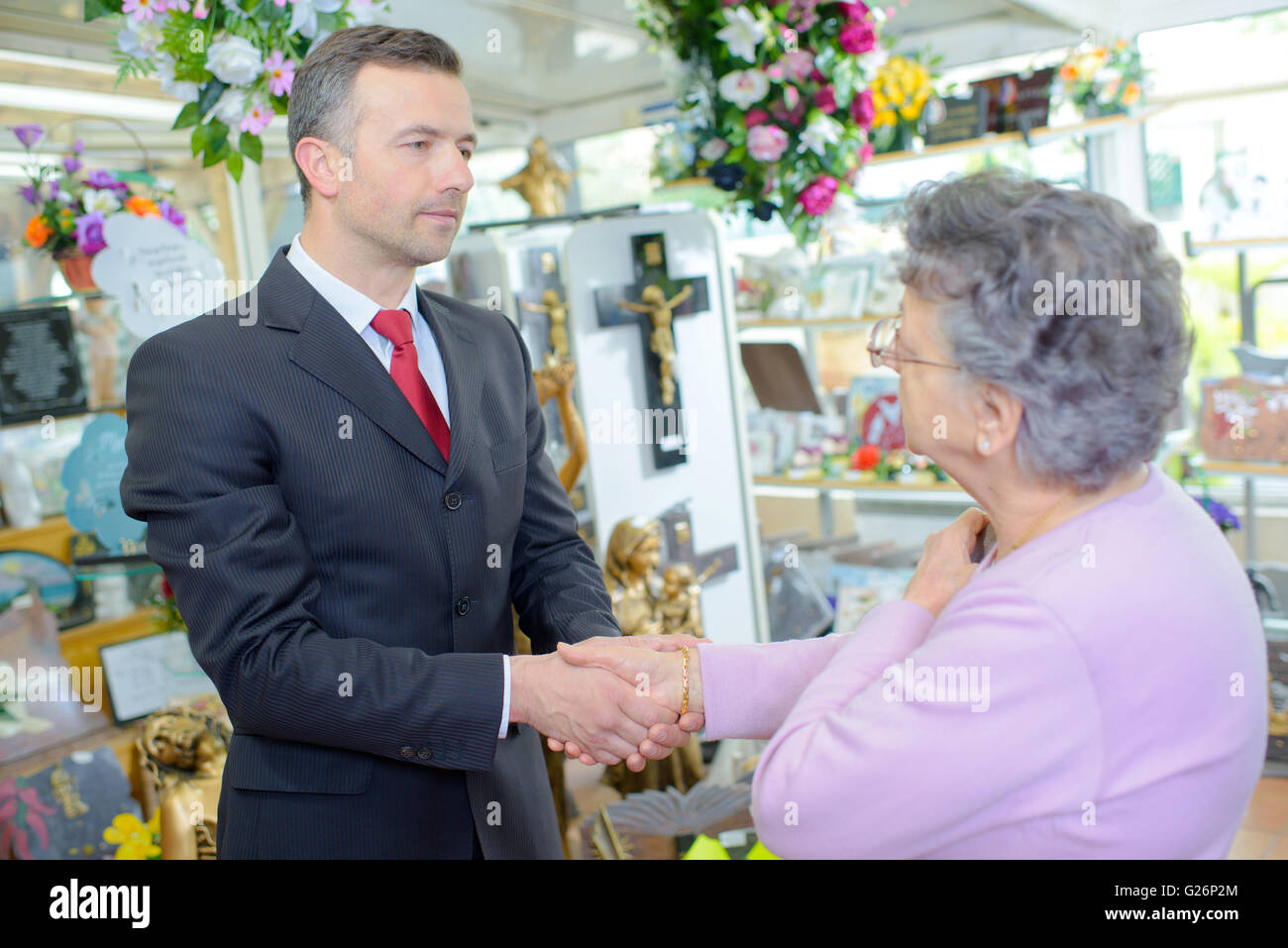 Woman senior welcome man hi-res stock photography and images - Alamy