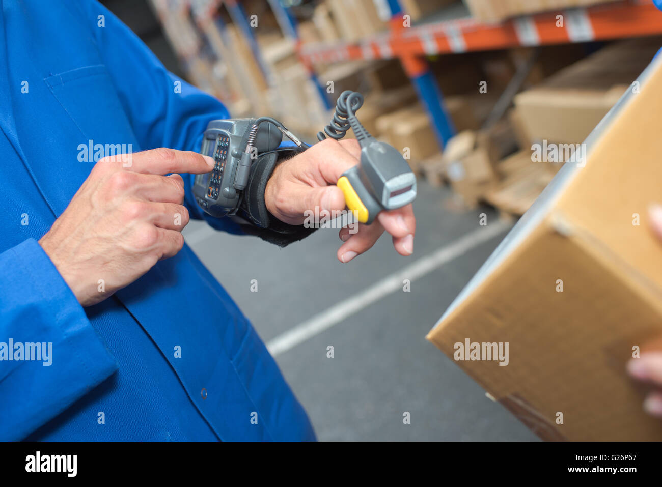 Man using wearble barcode scanner Stock Photo - Alamy